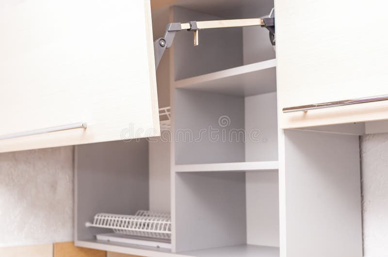 Lines of Empty Kitchen Cabinets at Renovated Kitchen Stock Photo ...