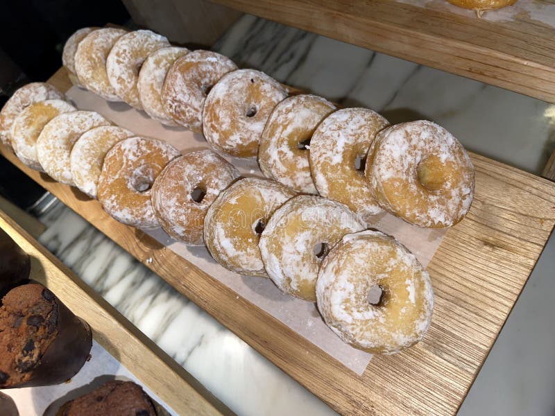 Lines of Fresh Delicious Donuts on Bakery Shop, Tasty Multiple Donuts ... Lines of Fresh Delicious Donuts on Bakery Shop, Tasty Multiple Donuts ...