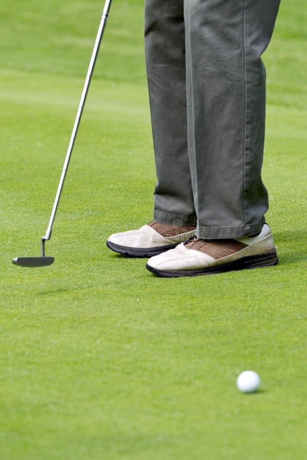 Lining up a putt stock image. Image of outdoors, fitness - 19926519