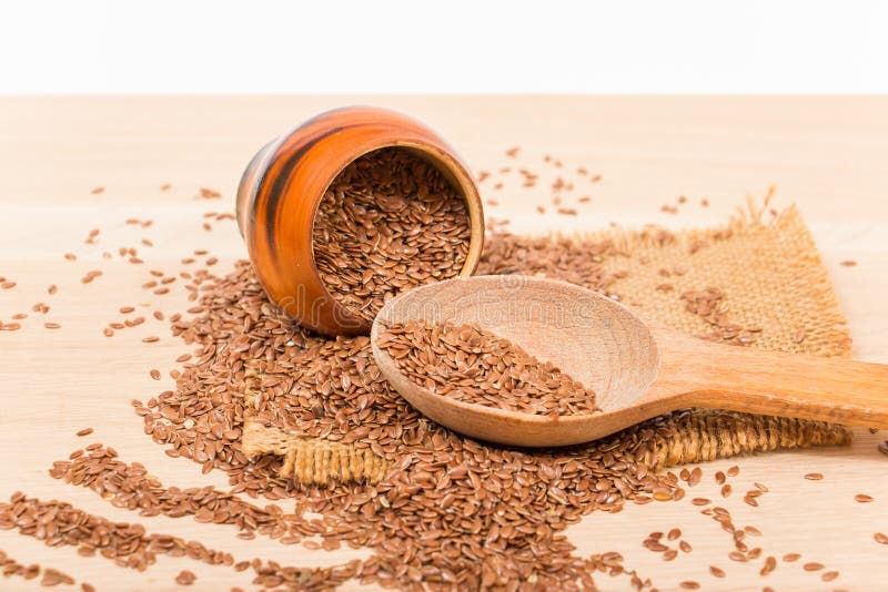 Linseed on wooden table stock photo. Image of linseed - 54067842