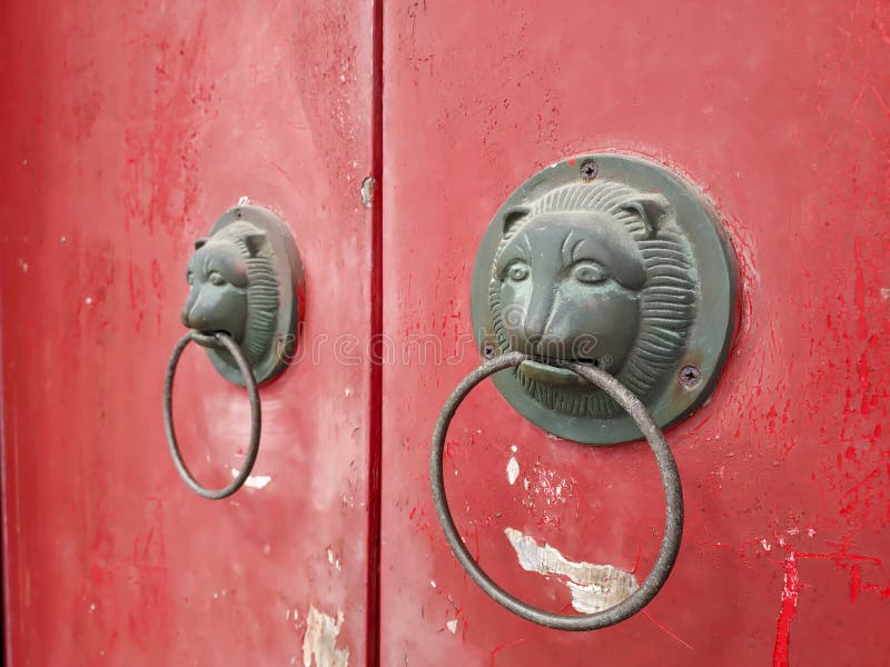 The Lion Door Ring on the Red Gate of a Temple Stock Photo - Image of ...