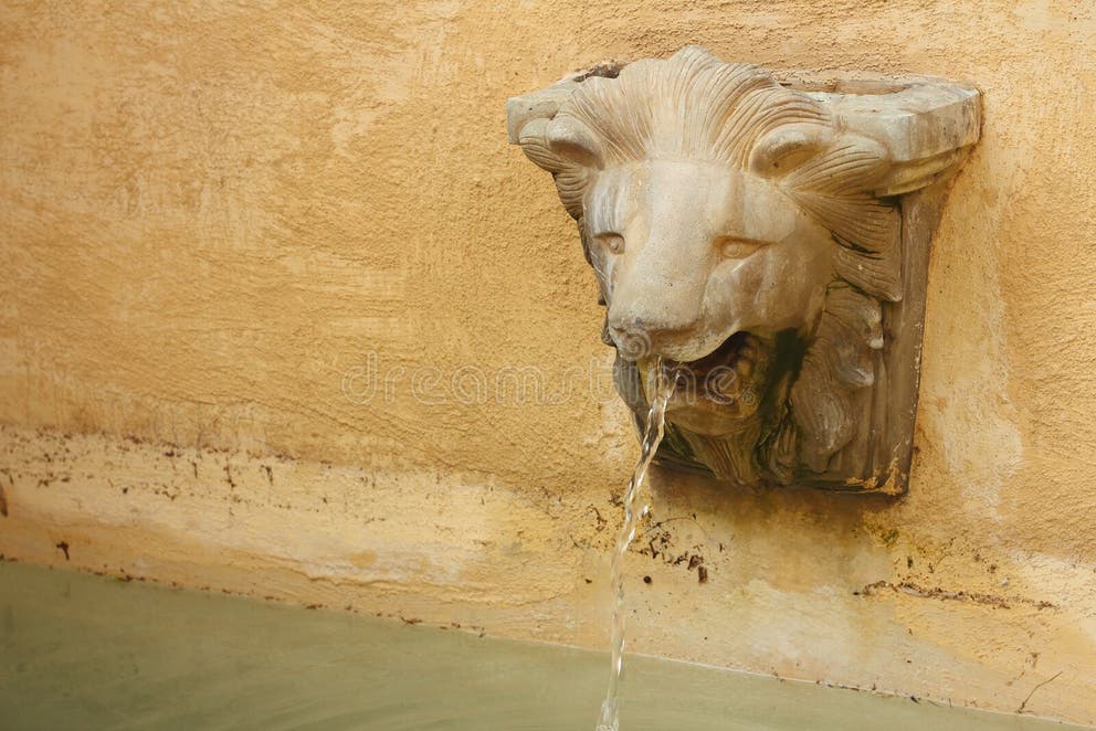 Lion Statue Spitting Water at the Park Stock Photo - Image of carved ...