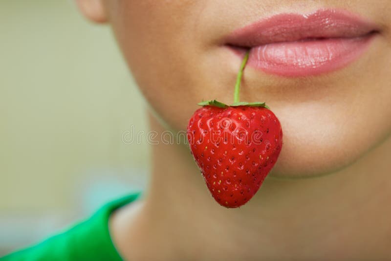 Lips with strawberry. stock photo. Image of lipstick - 44430084