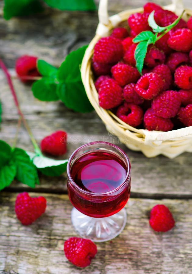 Liqueur from Raspberry in a Shot Glass Stock Photo - Image of wooden ...