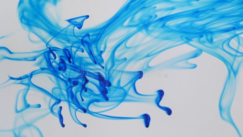 Liquid Abstractions, the Dissolution of Blue Paint in Water. Stock ...