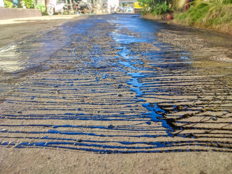 Liquid Asphalt that Has Been Splashed Onto the Road Stock Photo - Image ...