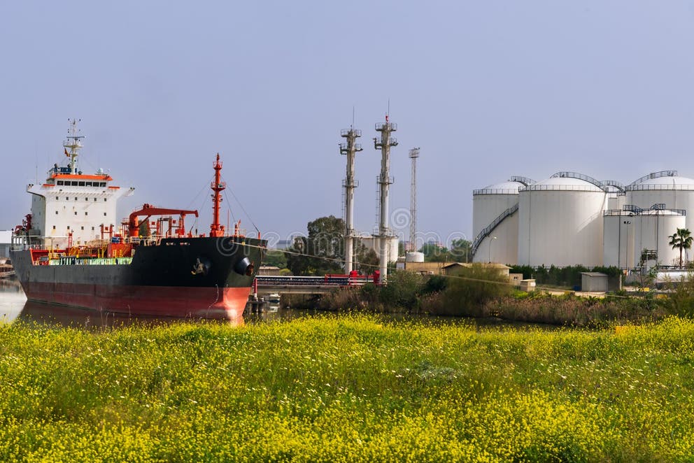 Liquid Bulk Merchant Ship Moored in a Dock of a River Port Next To Some ...