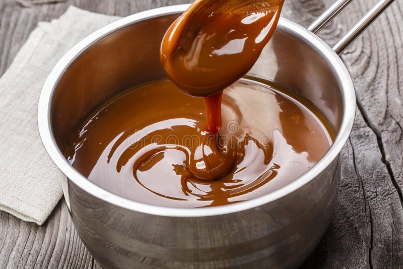 Liquid caramel is poured stock image. Image of sticky - 48026547