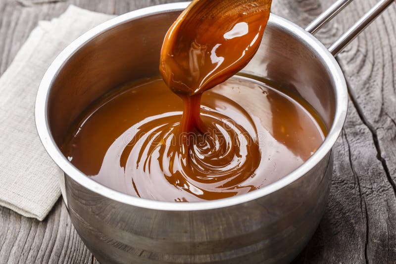 Liquid caramel is poured stock image. Image of food, delicious - 48027111