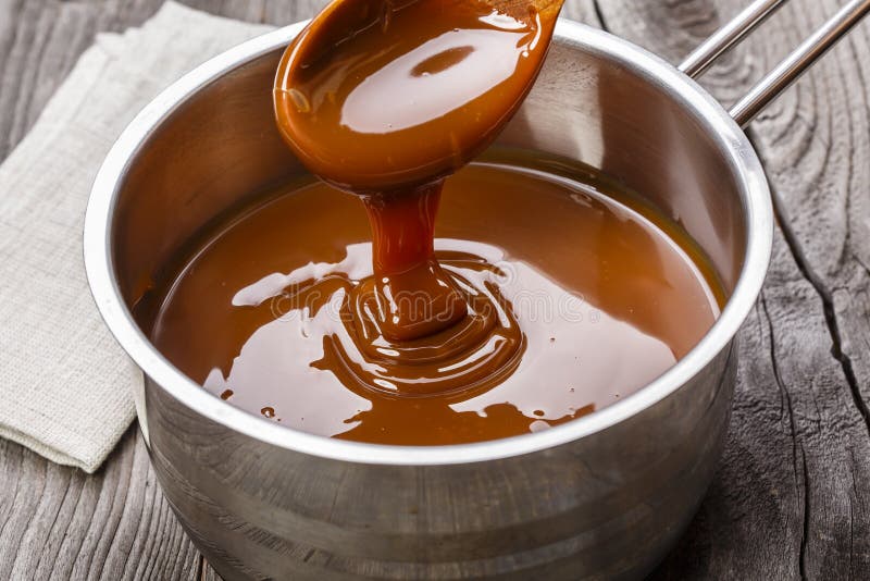 Liquid caramel is poured stock image. Image of sticky - 48026547
