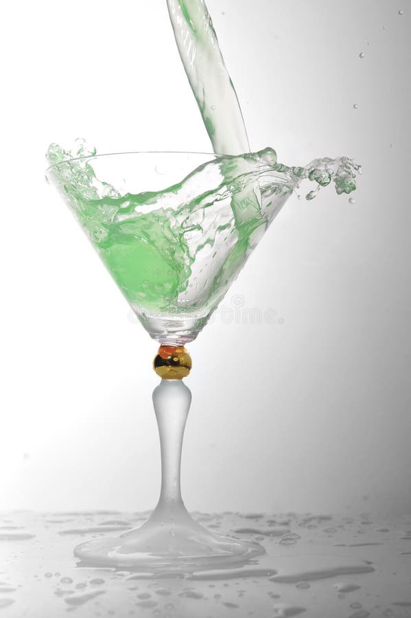 Liquid in cocktail glass stock photo. Image of drops - 13543638