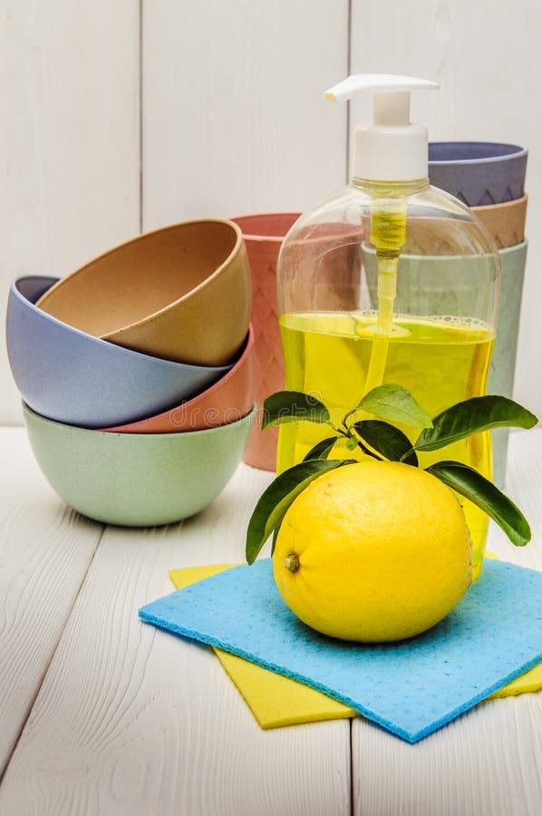 Liquid detergent and lemon stock image. Image of dishes - 110596585
