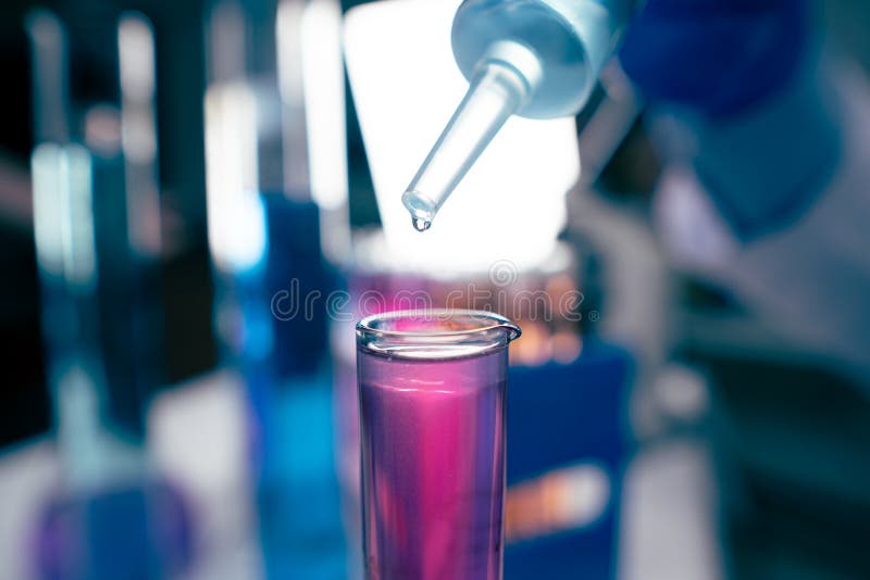 Liquid Drop Falling into Test Tubes Stock Photo - Image of girl ...