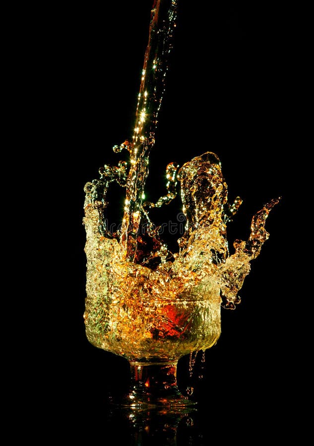 Liquid Falling Down in the Glass and Coins Near by Stock Photo - Image ...