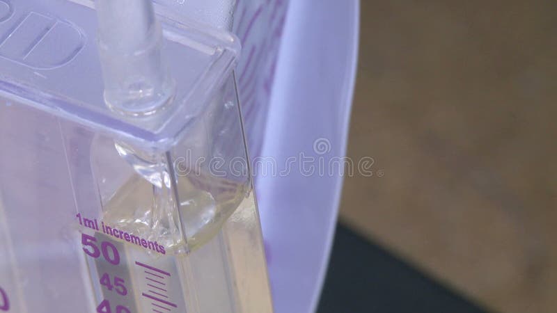 Red Liquid Flows through Spiral Tube in Laboratory Equipment Stock ...
