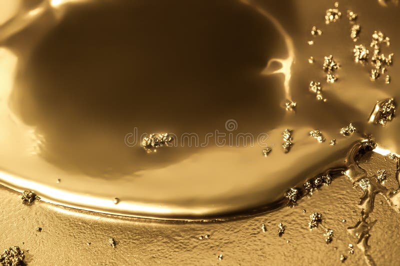 Liquid gold and gold dust. stock image. Image of bijouterie - 196003537