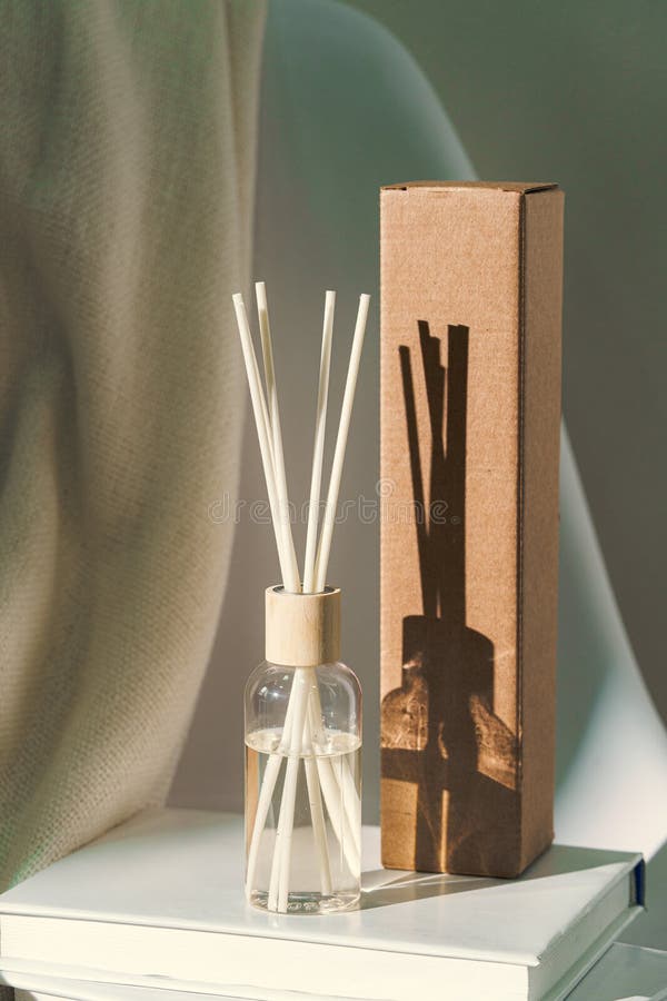 Liquid Home Perfume in Glass Diffuser with Sticks on Chair Stock Photo ...