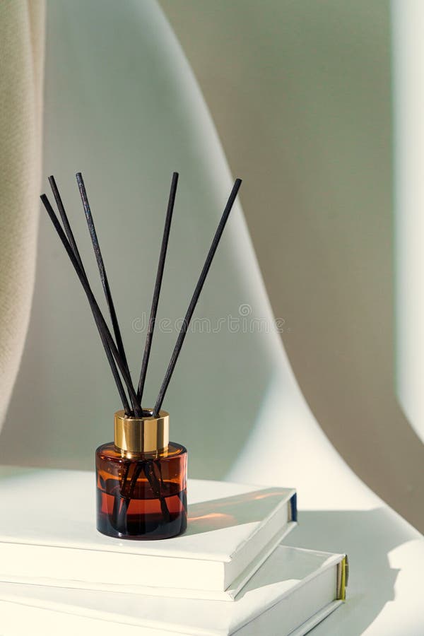 Liquid Home Perfume in Glass Diffuser with Sticks on Chair Stock Photo ...