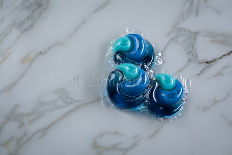 Liquid Laundry Detergent Pods with Gel and Softener in Blue and Lilac ...