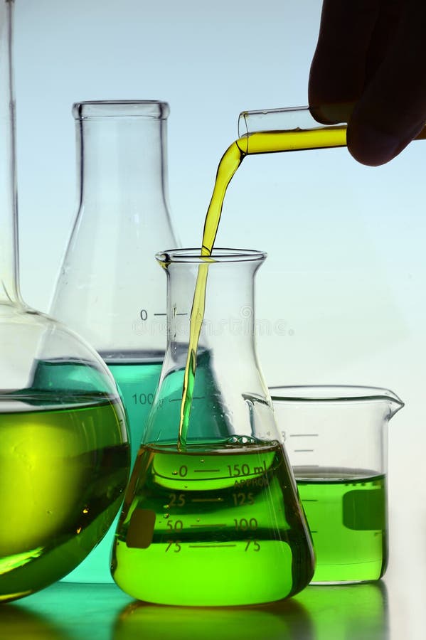 Liquid Pouring into a Flask Stock Image - Image of laboratory, green ...