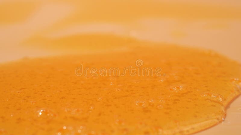 Liquid Shower Gel Flows Gracefully Across a Bright Orange Background ...