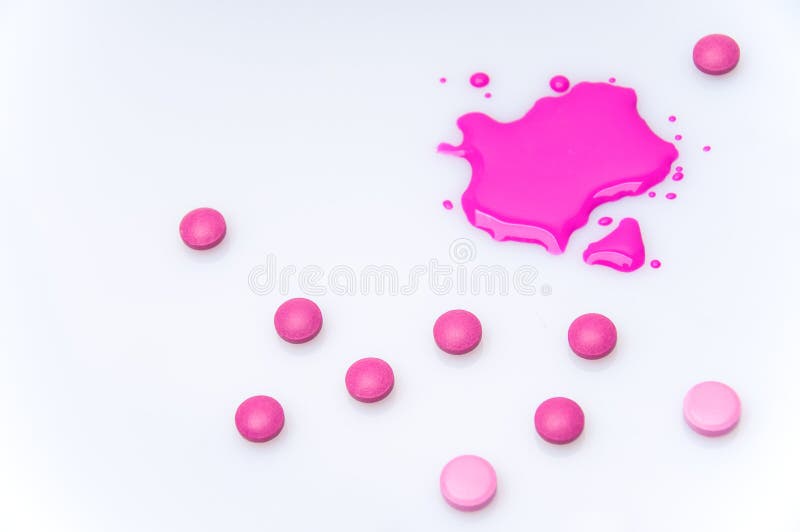 A Medical Syringe with a Purple Solution Lies on a White Background ...