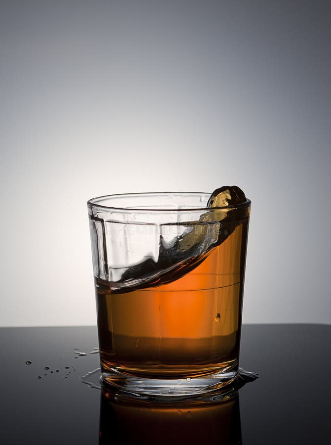 Liquid splashed in glass. stock image. Image of quench - 28524913