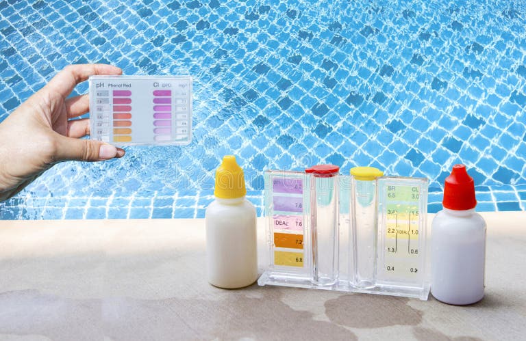 Liquid Water Testing Test Kit on Swimming Pool Edge Over Clear Water ...