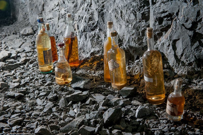 Liquor Bottles Aged in the Mine Stock Photo - Image of bottles, bottle ...