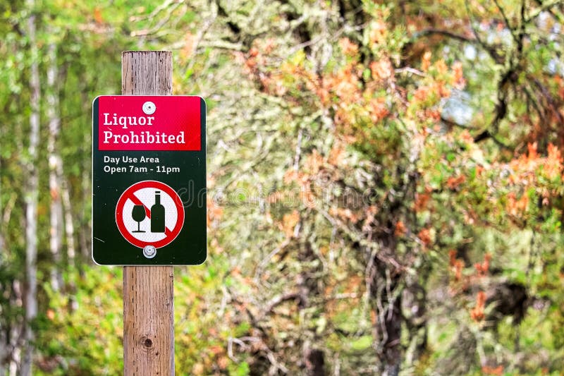 A Liquor Prohibited Day Use Sign with Trees in the Background Stock ...