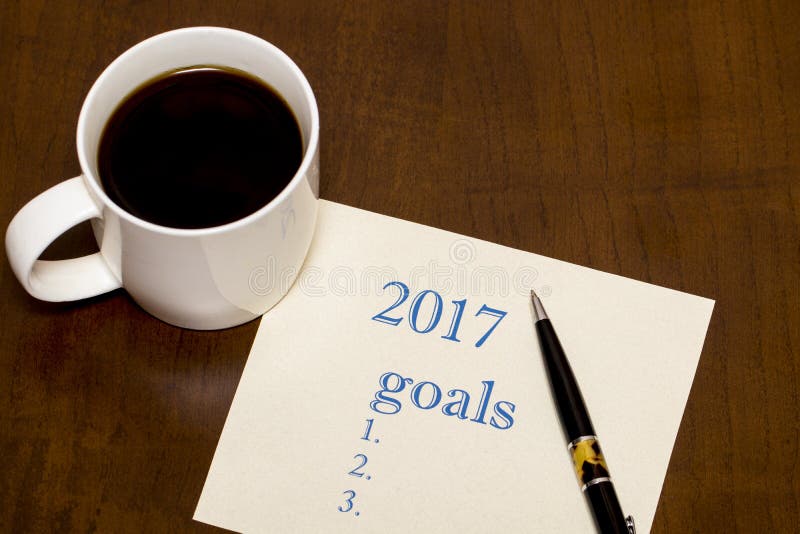 2017 List of Goals on Paper, a Wooden Table with a Cup of Coffee Stock ...
