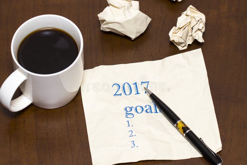 2017 List of Goals on Paper, a Wooden Table with a Cup of Coffee Stock ...