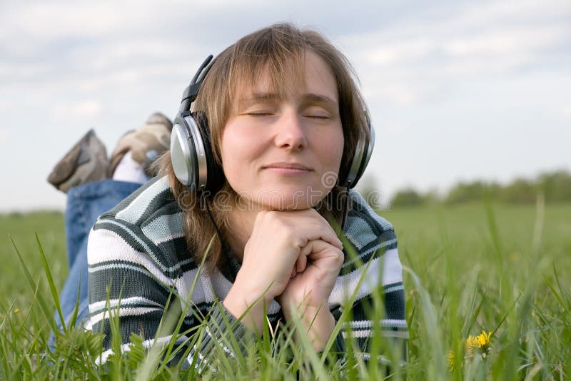 Listen to the music stock photo. Image of delight, cans - 5332084