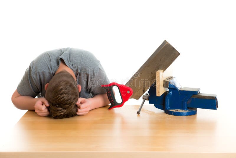 Listless Teenager in Professional Training with Saw Stock Photo - Image ...