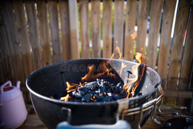 Lit Barbeque Getting really Hot.. Stock Photo - Image of tasty ...