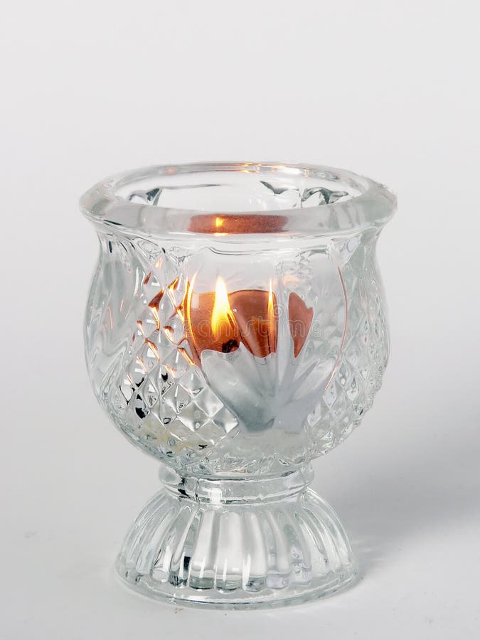 Lit Candle in Candleholder stock image. Image of calm - 1573097
