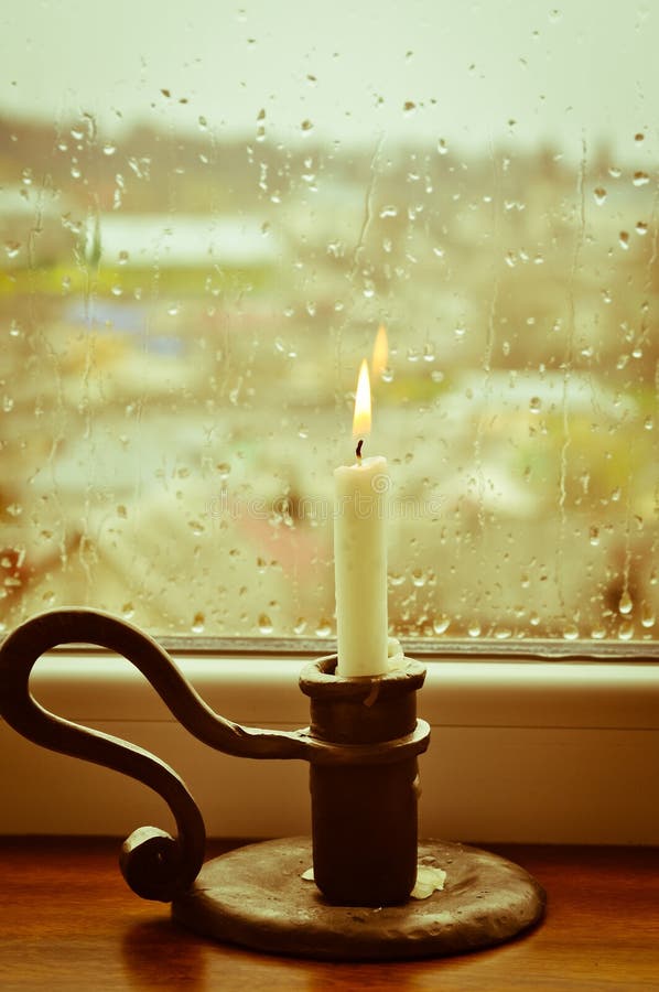 A Lit Candle on a Rainy Day Stock Image - Image of candlelight, antique ...