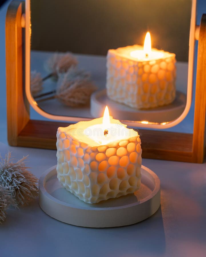 Lit Cube Handmade Soy Candle in Front of a Mirror with Dried Decorative ...