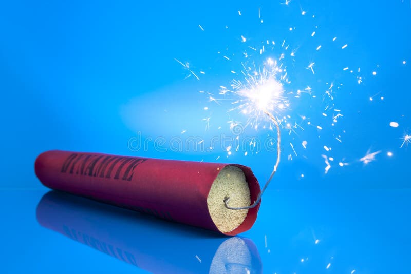 Lit Dynamite Stick on a Blue Background Stock Photo - Image of boom ...