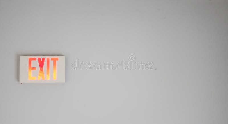 Lit Exit Sign with White Copy Space on Right Stock Image - Image of ...