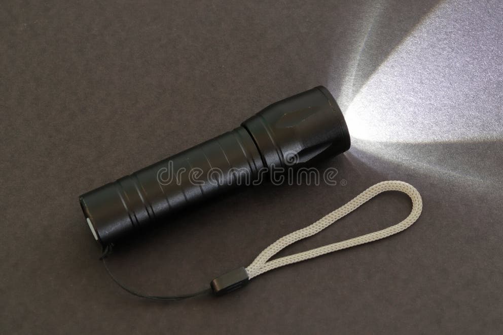 A Lit Flashlight with Its Cord Stock Image - Image of technology ...