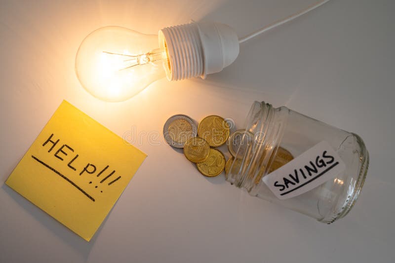 Lit Light Bulb with Coins and Piggy Bank. Increased Bills. Stock Photo ...