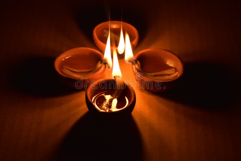 Lit oil lamps in the dark stock image. Image of glow - 202135361