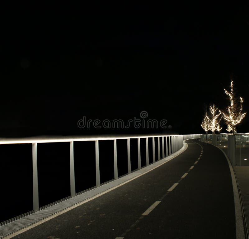A Lit Pathway with a Few Curves Leading into the Darkness Stock Image ...