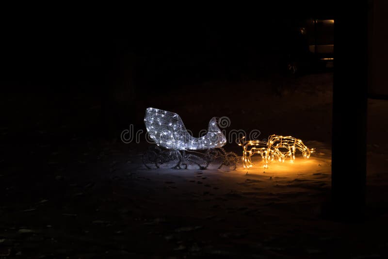 A Lit Santa Sleigh and Reindeer at Night Stock Photo - Image of outdoor ...