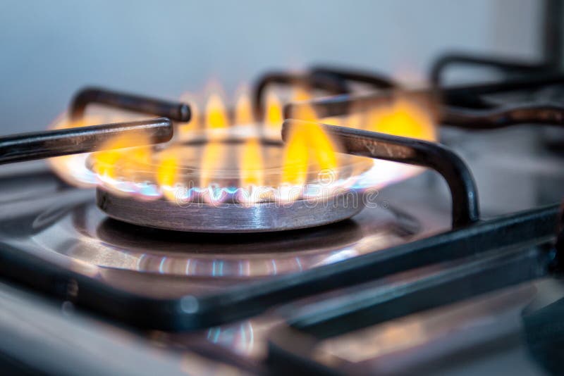 Lit stove in old gas stove stock image. Image of domestic - 186400653