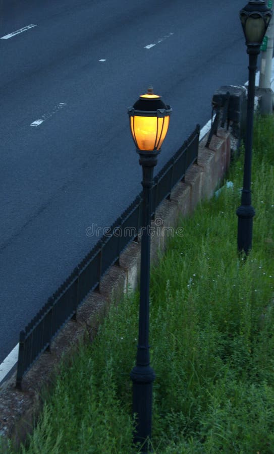 Lit streetlight at dusk stock photo. Image of night, evening - 96762428