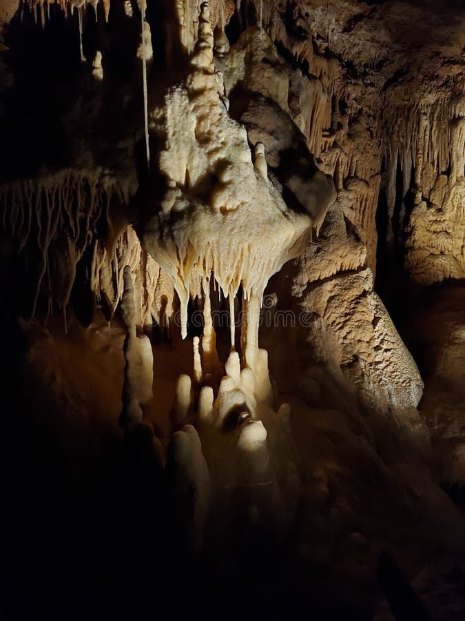 Lit up cave formations stock image. Image of underground - 149984253