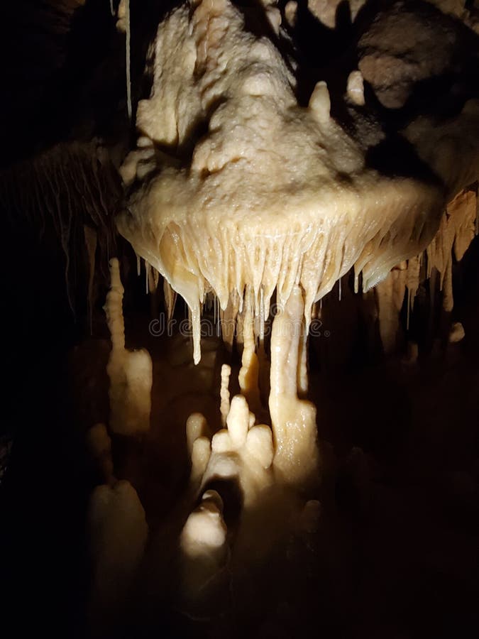Lit up cave formations stock photo. Image of cavern - 149984468