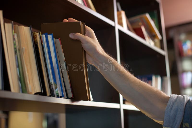 Human Hand Taking Book Library Stock Photos - Free & Royalty-Free Stock ...